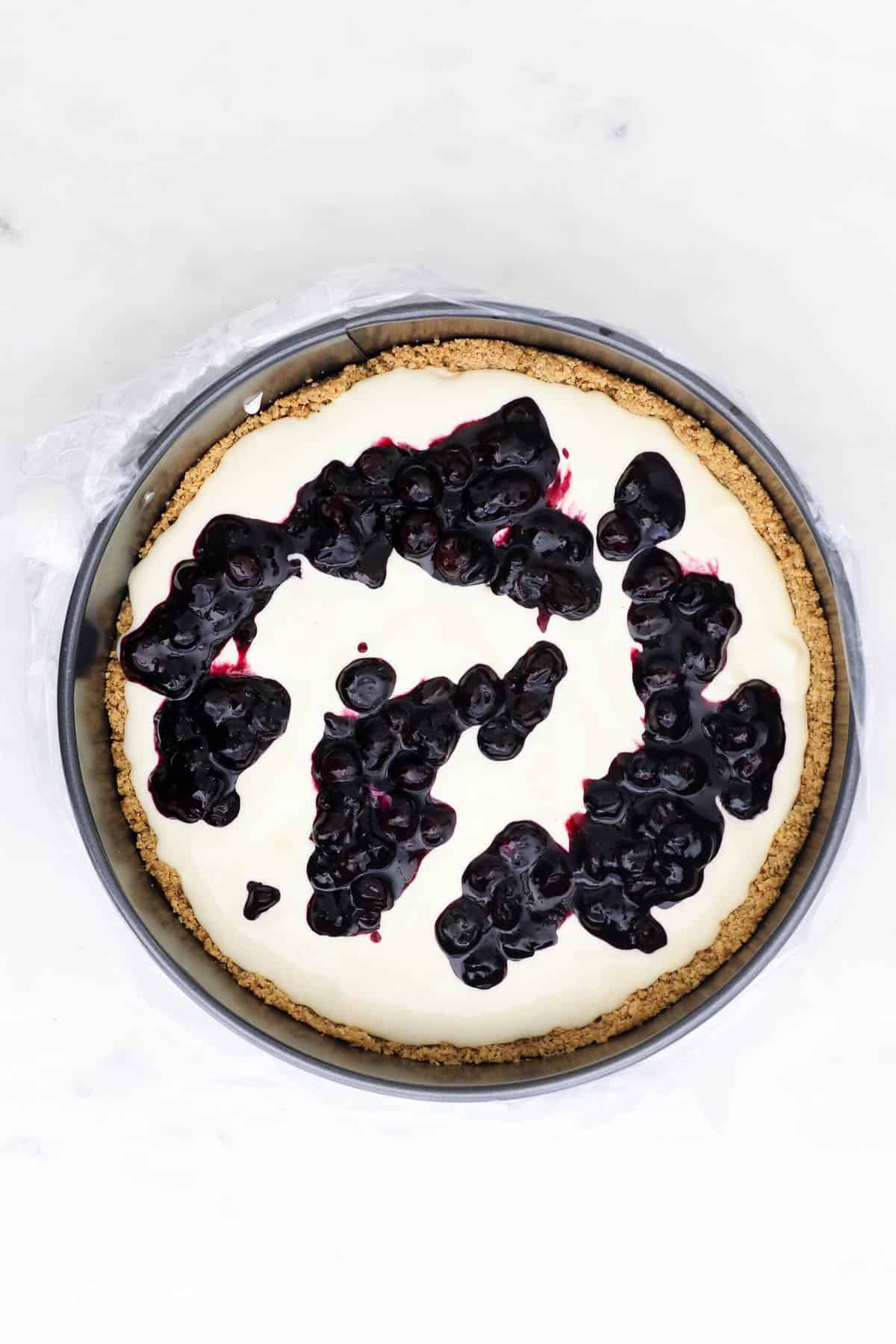 Easy Blueberry Swirled Cheesecake | Beyond Frosting