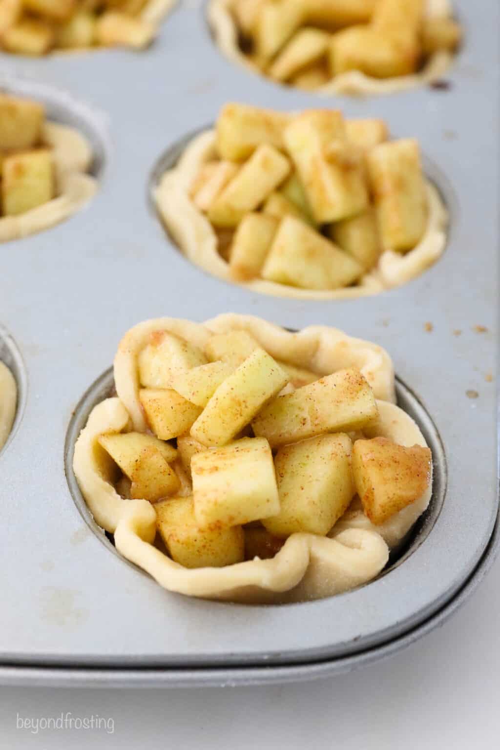 Mini Apple Pies (Baked in a Muffin pan) | Beyond Frosting